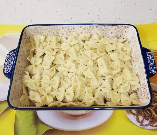 Layer of ready macaroni in the form for baking