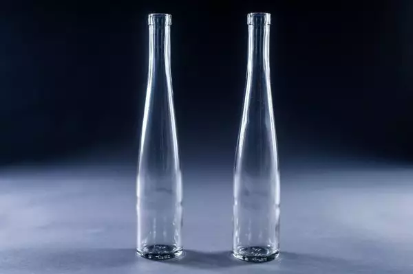 Two glass vases with narrow neck