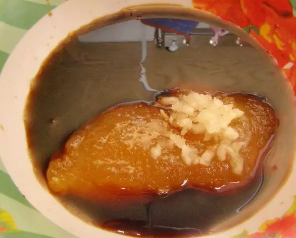 Soy sauce, crushed garlic and honey in a bowl