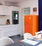 Orange refrigerator sa mahayag nga background kitchen retro