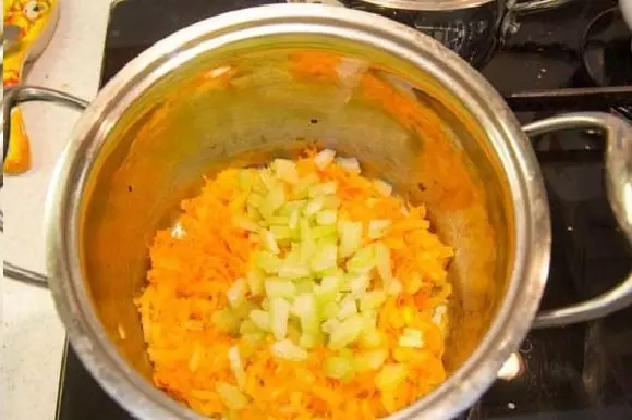 Stew vegetables in a saucepan