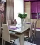 The combination of beige and purple in the kitchen-dining room