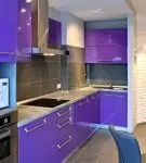 Purple furniture with white countertop on a small kitchen