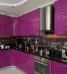 Dark apron, complementing the purple headset in the kitchen with a white ceiling