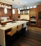 Brown furniture in the kitchen with an island