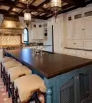 Island furniture in the kitchen with chandeliers in oriental style