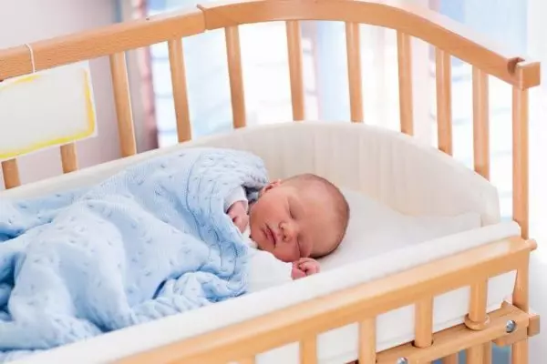 Newborn in the crib