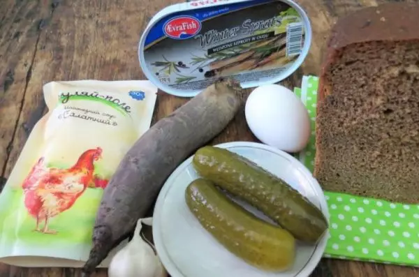 Products for cooking sandwiches with sprats and beet salad on the table