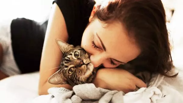 Girl Kisses Cat.
