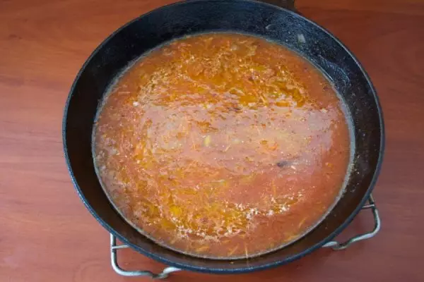 Tomato and vegetable roasted in a large pan on the table