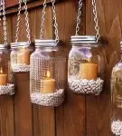 Glass cans with candles inside