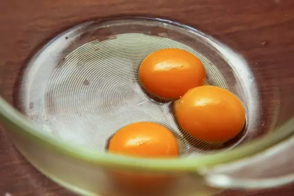 Raw egg yolks in glass tank