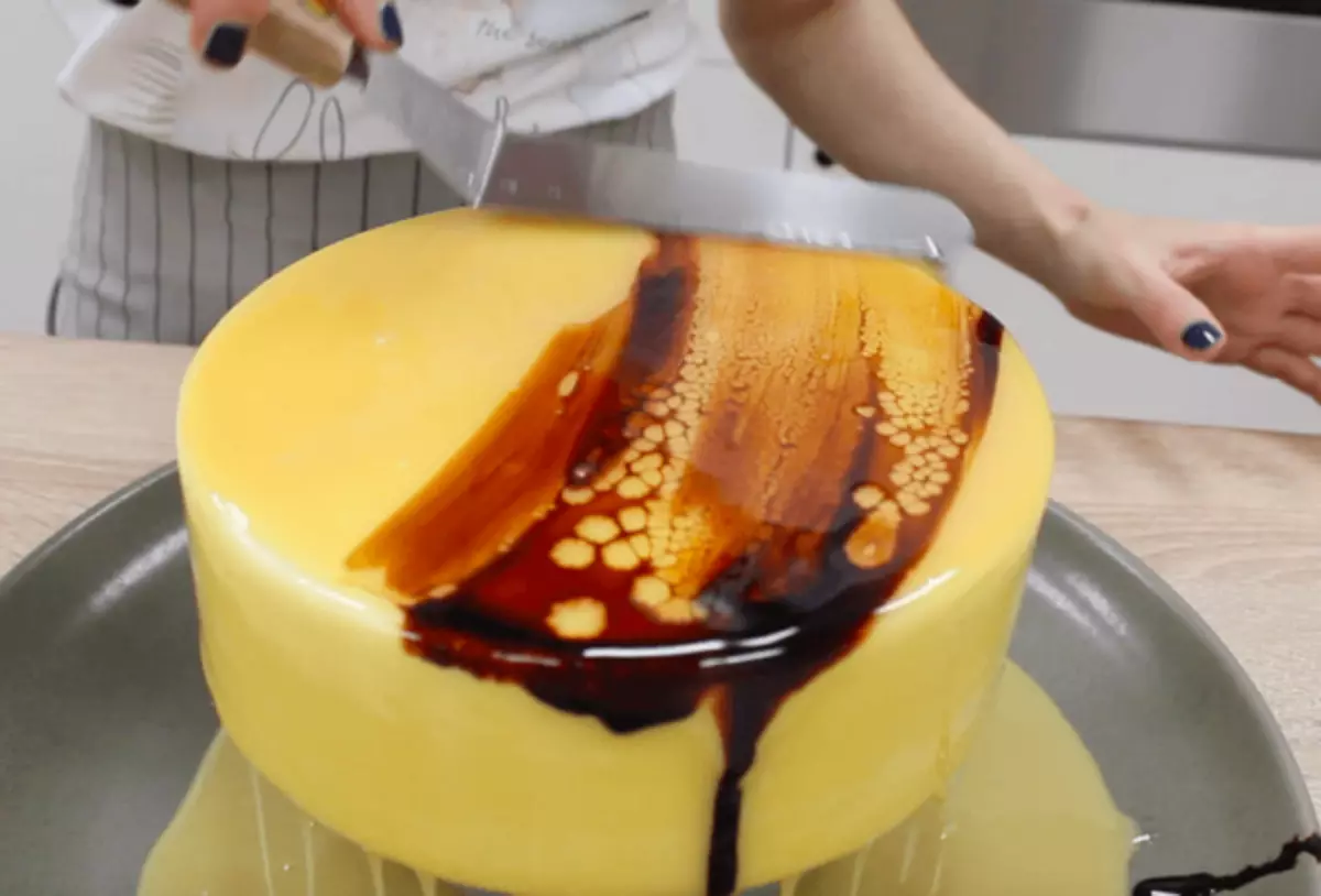 Glaze is applied to the cake