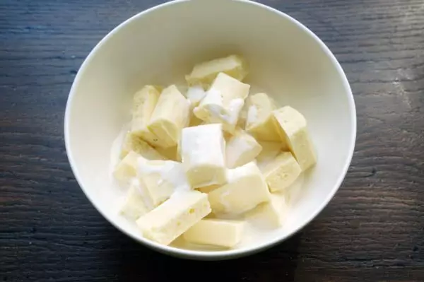 Pieces of white chocolate in milk