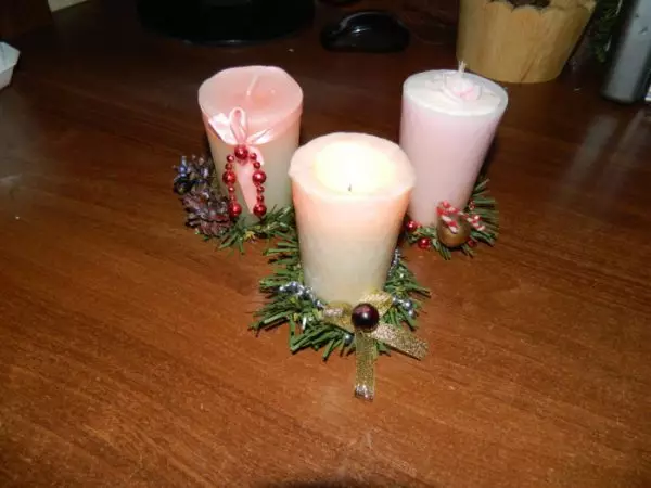 Homemade candles with New Year decor