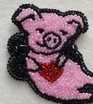 Brooch in the form of a pig of beads