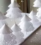 Christmas tree for decoration of a house of lace paper napkins and wooden speakers
