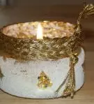 Candlestick from cans, decorated with salt and golden thread