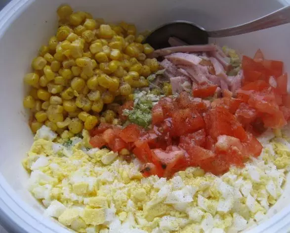 Prepared ingredients for rapid snack salad in a big bowl