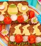 Sandwich on black bread with cheese figures