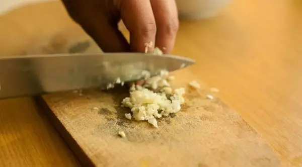 Garlic cut on a cutting board