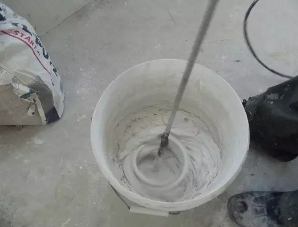 Stirring Puttles by a construction mixer