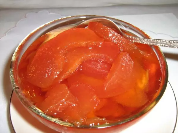Senggol amber saka quince ing mangkuk kaca