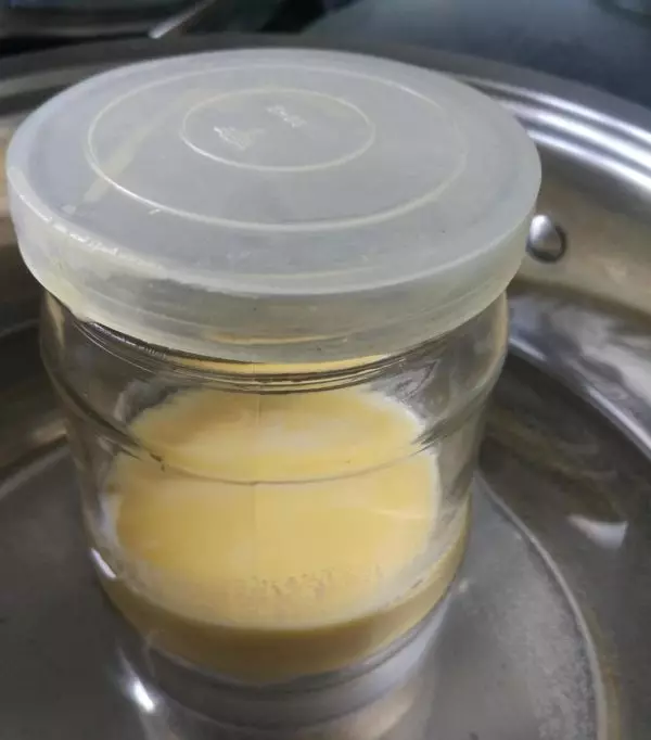 An egg-milk mixture for omelet in a glass jar with a kapron lid