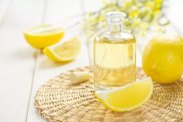 Lemons and a bottle of vinegar