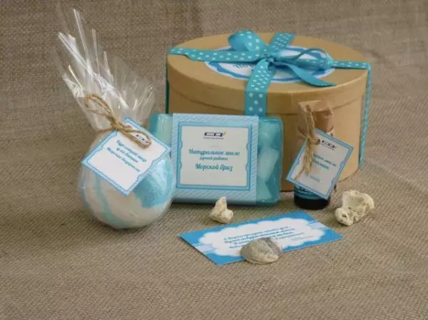 Handmade Blue Bowls and Soaps Next to Round Beige Box with Blue Ribbon